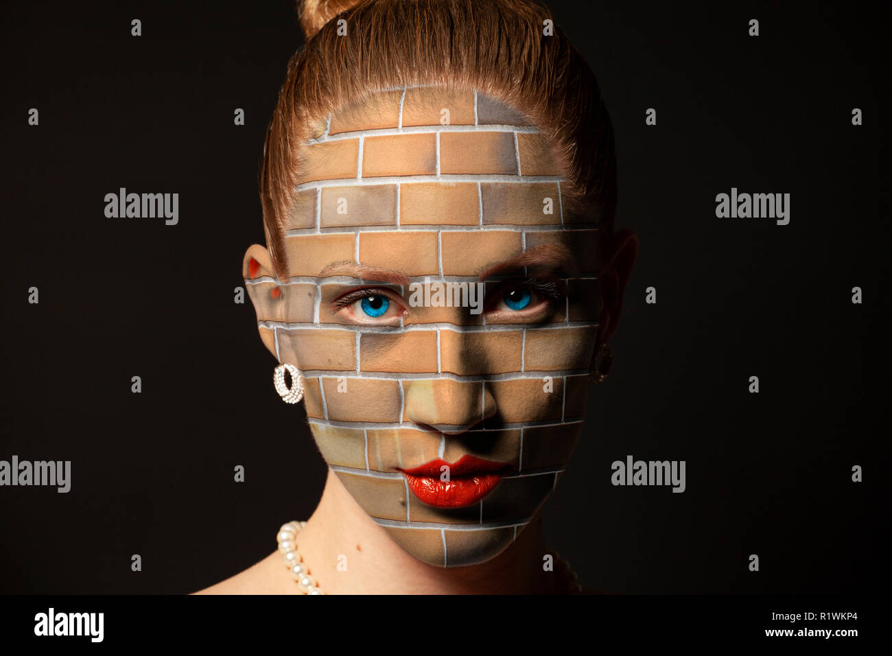Woman face covered with brick wall Stock Photo - Alamy