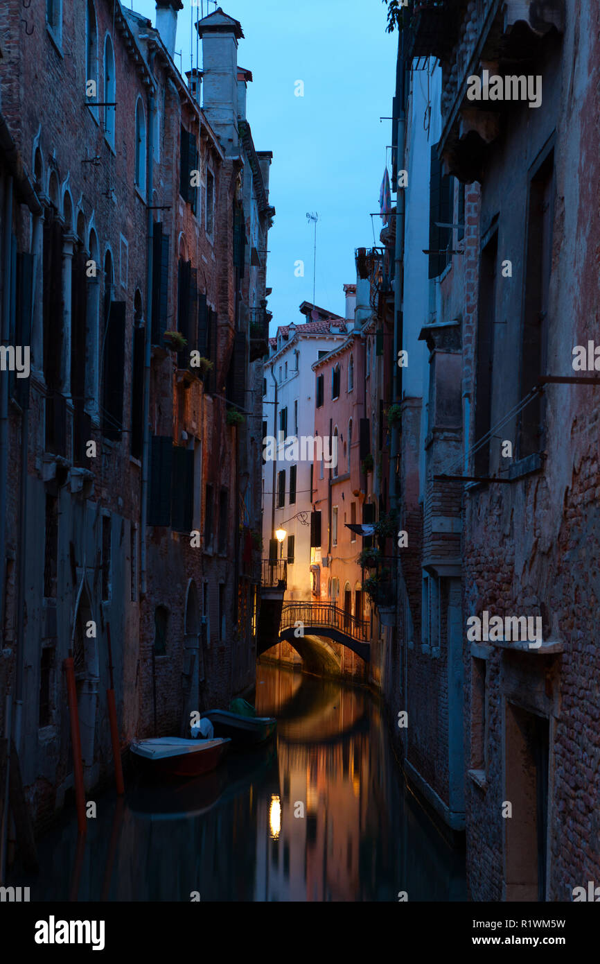 Narrow canal in Venice at twilight , Italy Stock Photo - Alamy