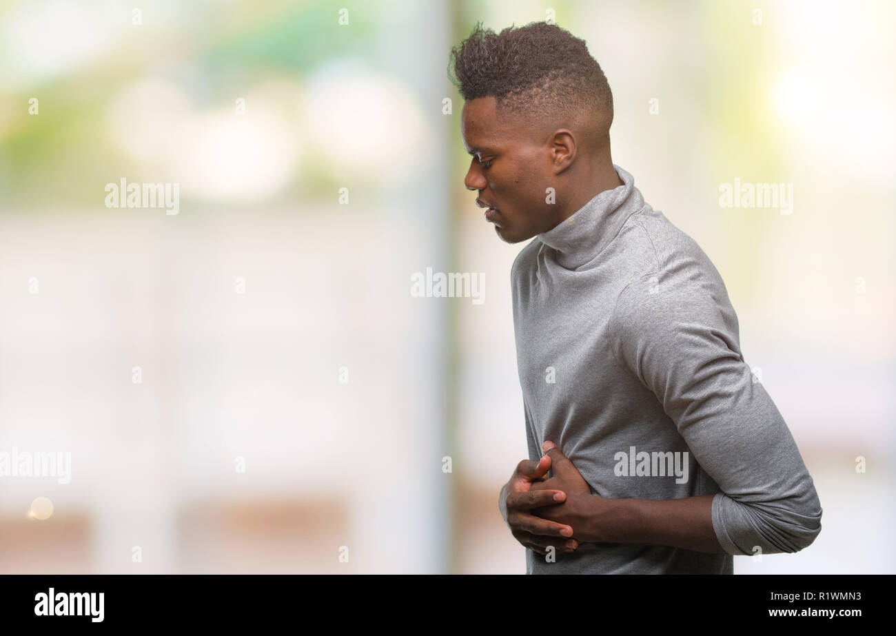 Young african american man over isolated background with hand on ...