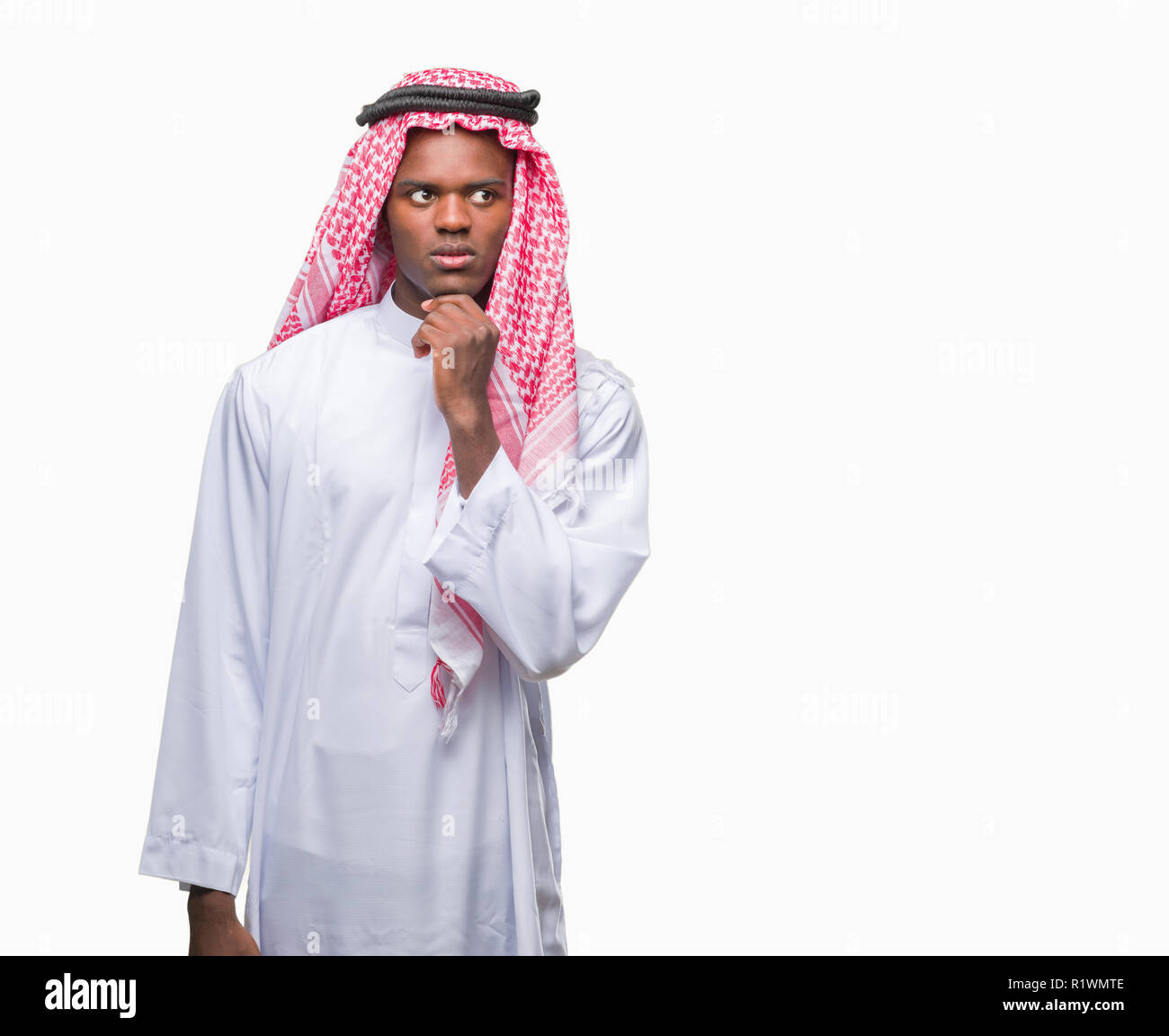 Young arabic african man wearing traditional keffiyeh over isolated ...