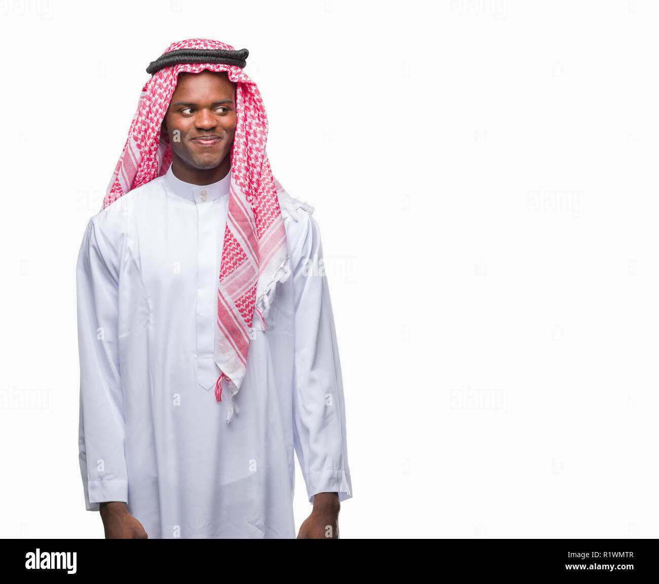Young arabic african man wearing traditional keffiyeh over isolated ...