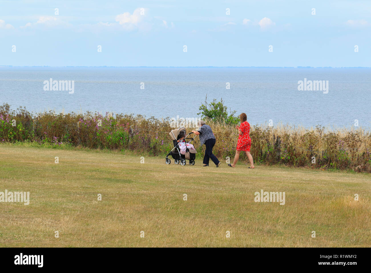 Elderly woman pushing pram hi-res stock photography and images - Alamy