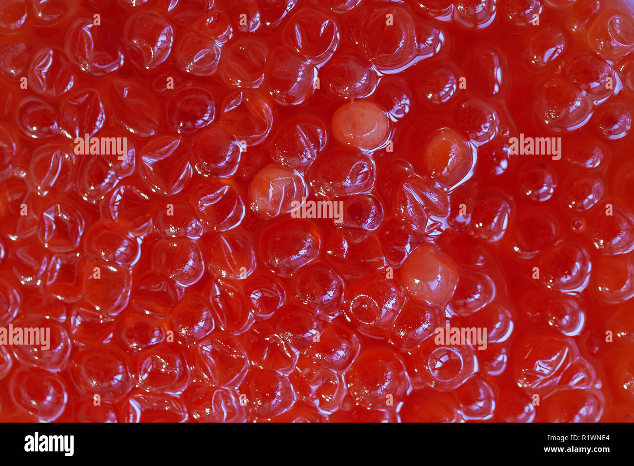 Natural red caviar of salmon, texture and background Stock Photo - Alamy