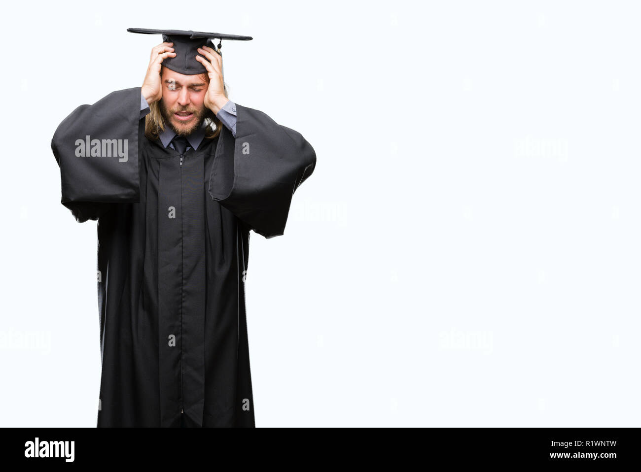 Young handsome graduated man with long hair over isolated background ...