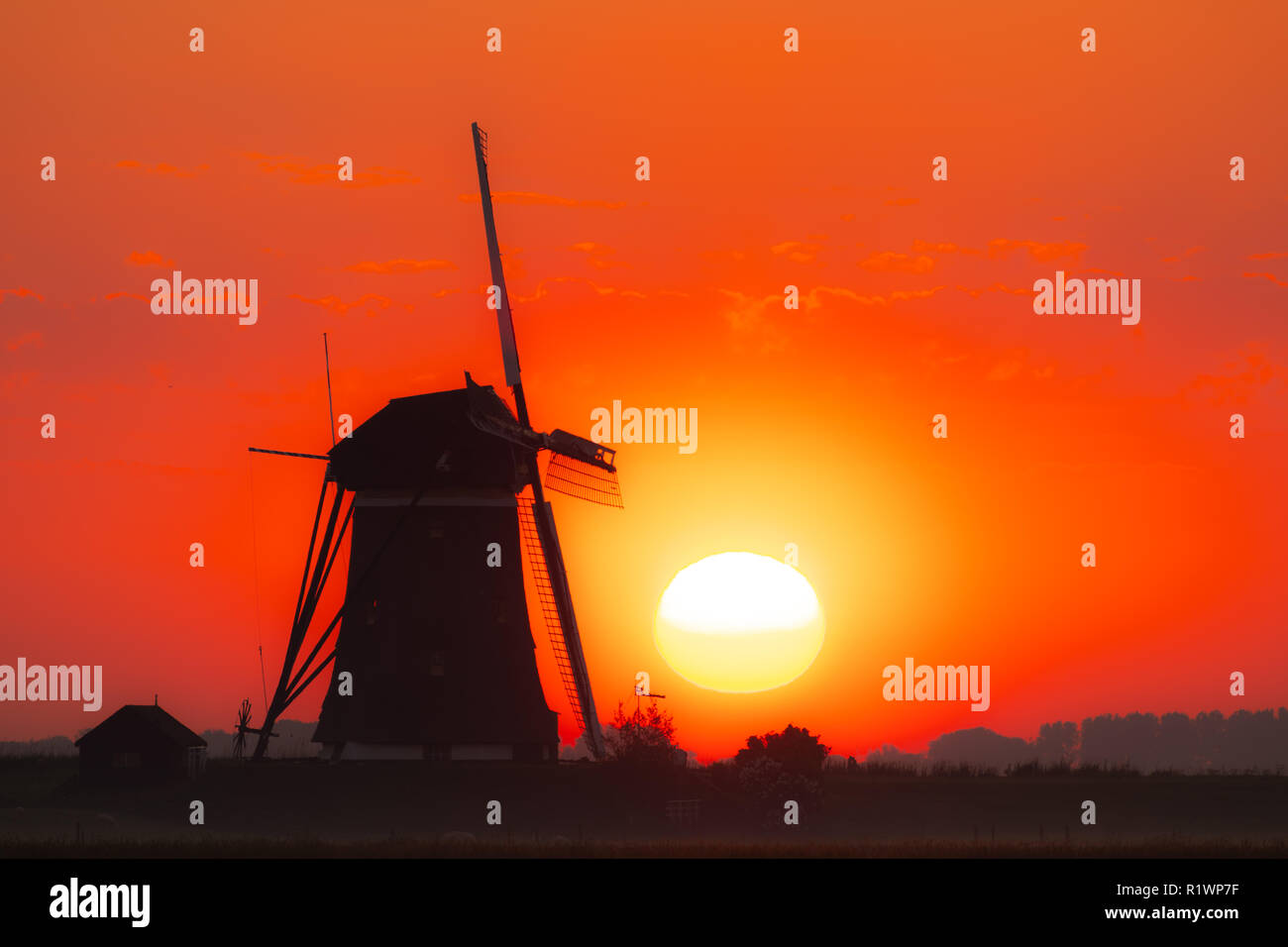 DUTCH WINDMILL DURING SUNRISE Stock Photo - Alamy
