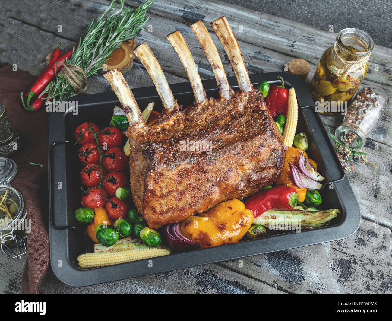 Grilled roasted rack of lamb,mutton with vegetables on the baking sheet ...