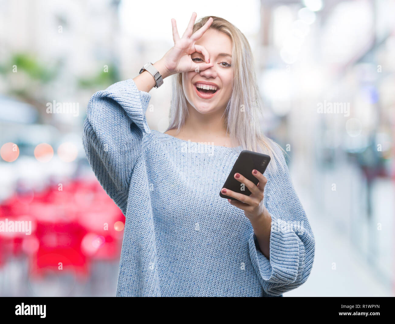 Young blonde woman texting sending message using smartphone over ...