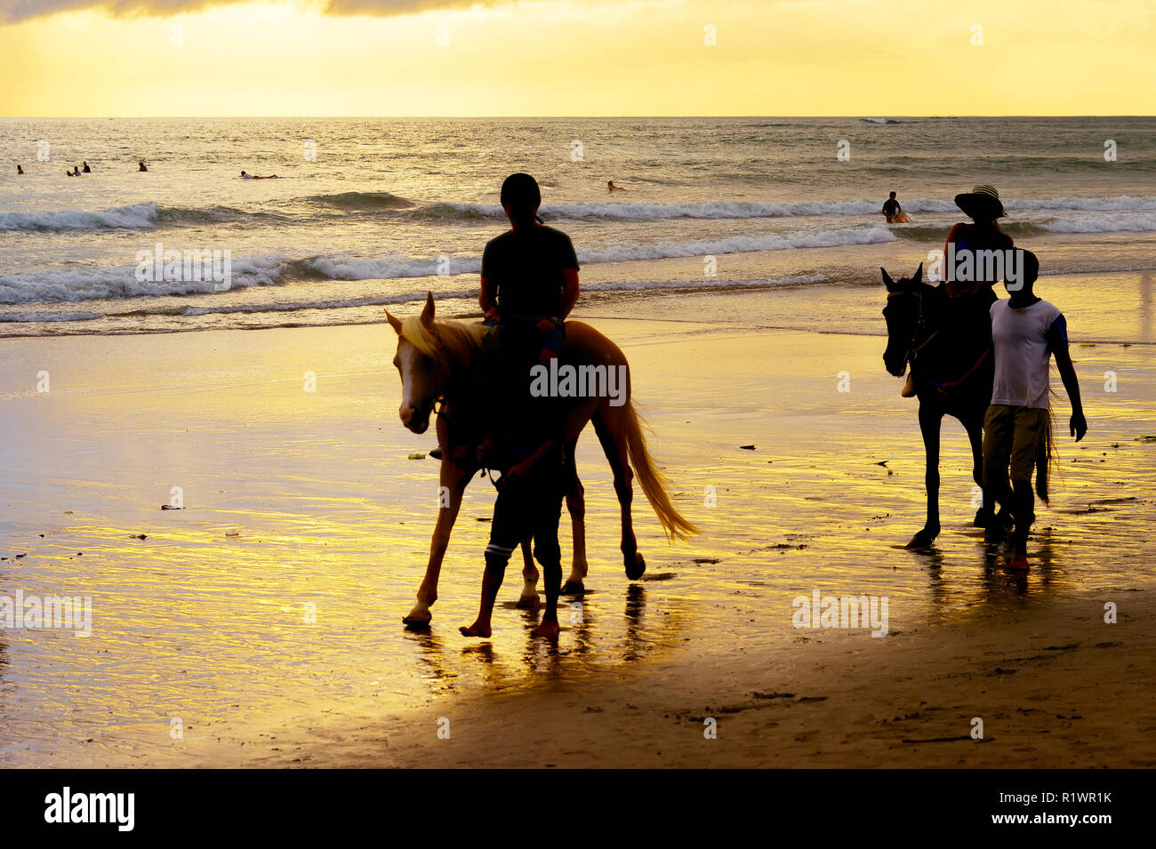 Riding horses at sunset hi-res stock photography and images - Alamy