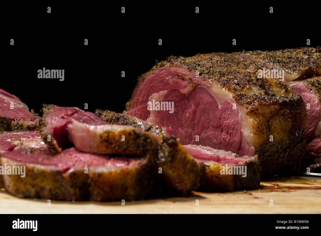 large freshly roasted prime rib sliced for food service at a restaurant ...