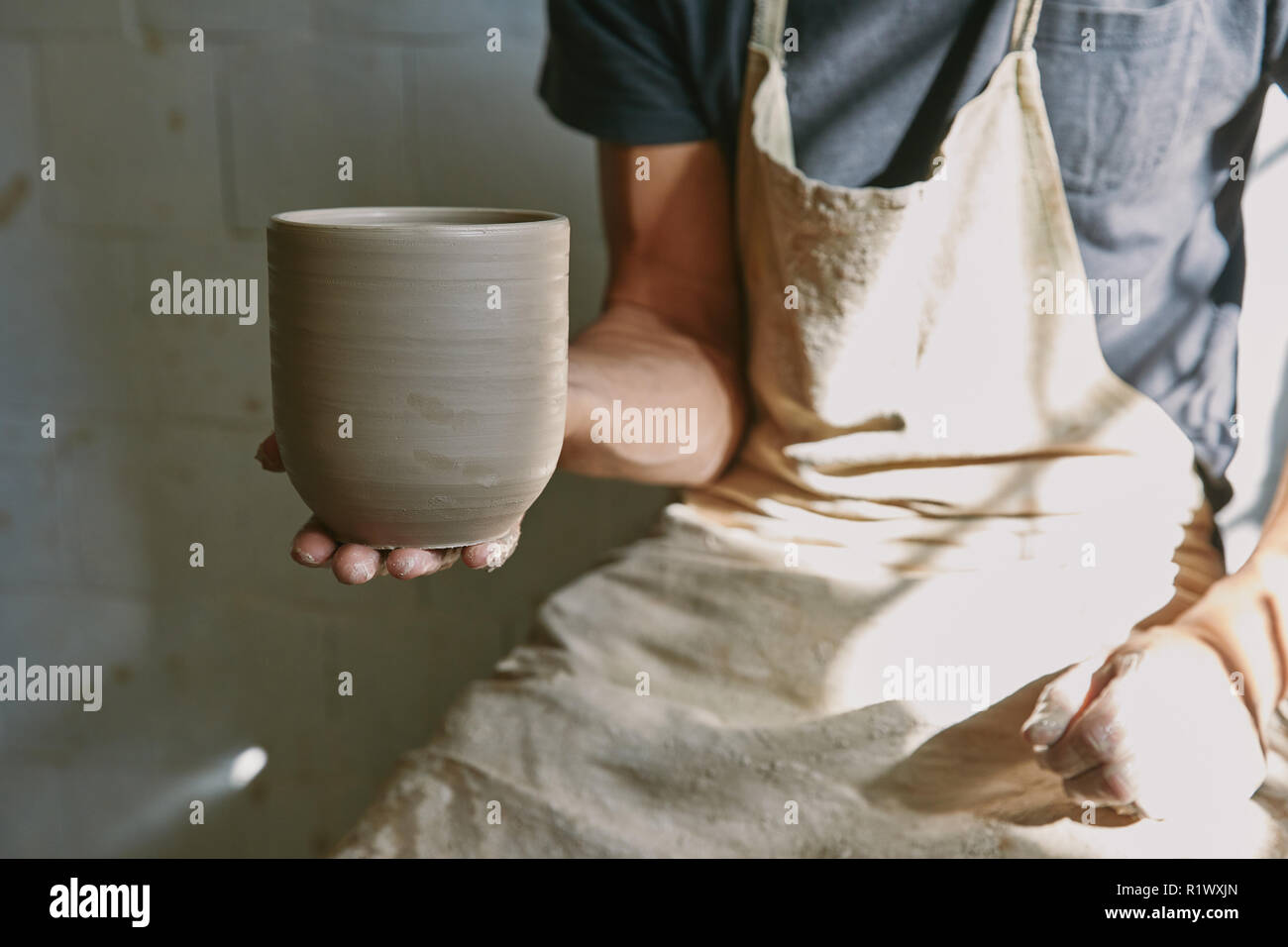 Cropped hands making clay pot hi-res stock photography and images - Alamy
