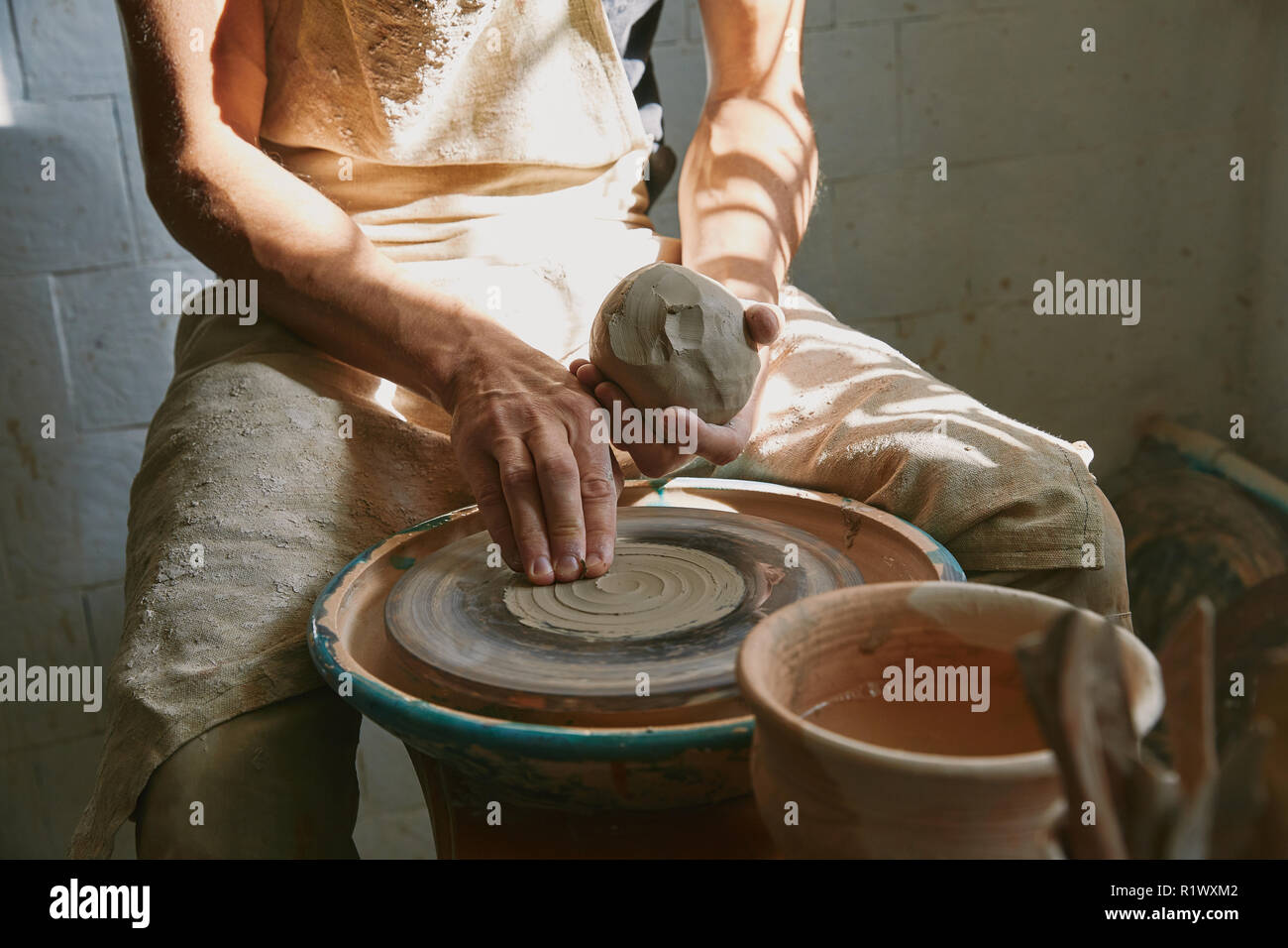 partial view of professional potter working with clay at workshop Stock ...