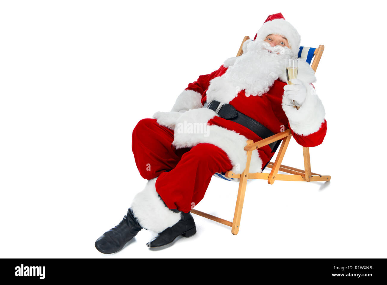Santa claus celebrating champagne Cut Out Stock Images & Pictures - Alamy