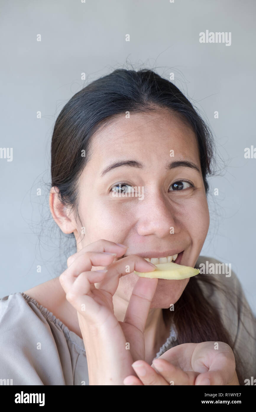 Emotions from the sour on the cute asian woman face Stock Photo - Alamy