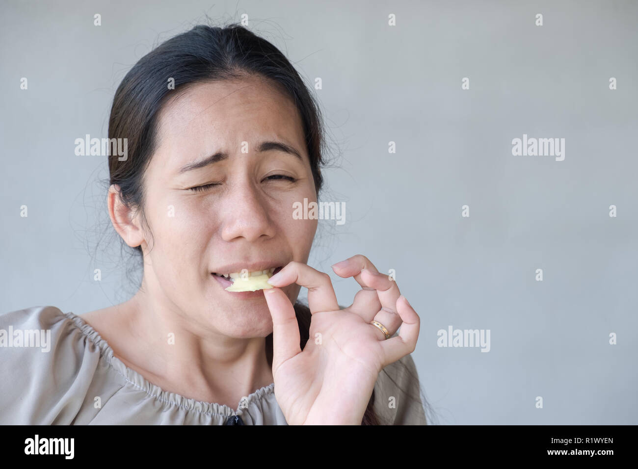 Woman taste sour hi-res stock photography and images - Alamy