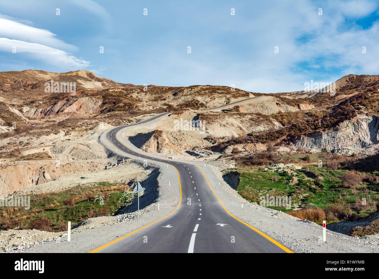 Winding road in mountains area Stock Photo - Alamy