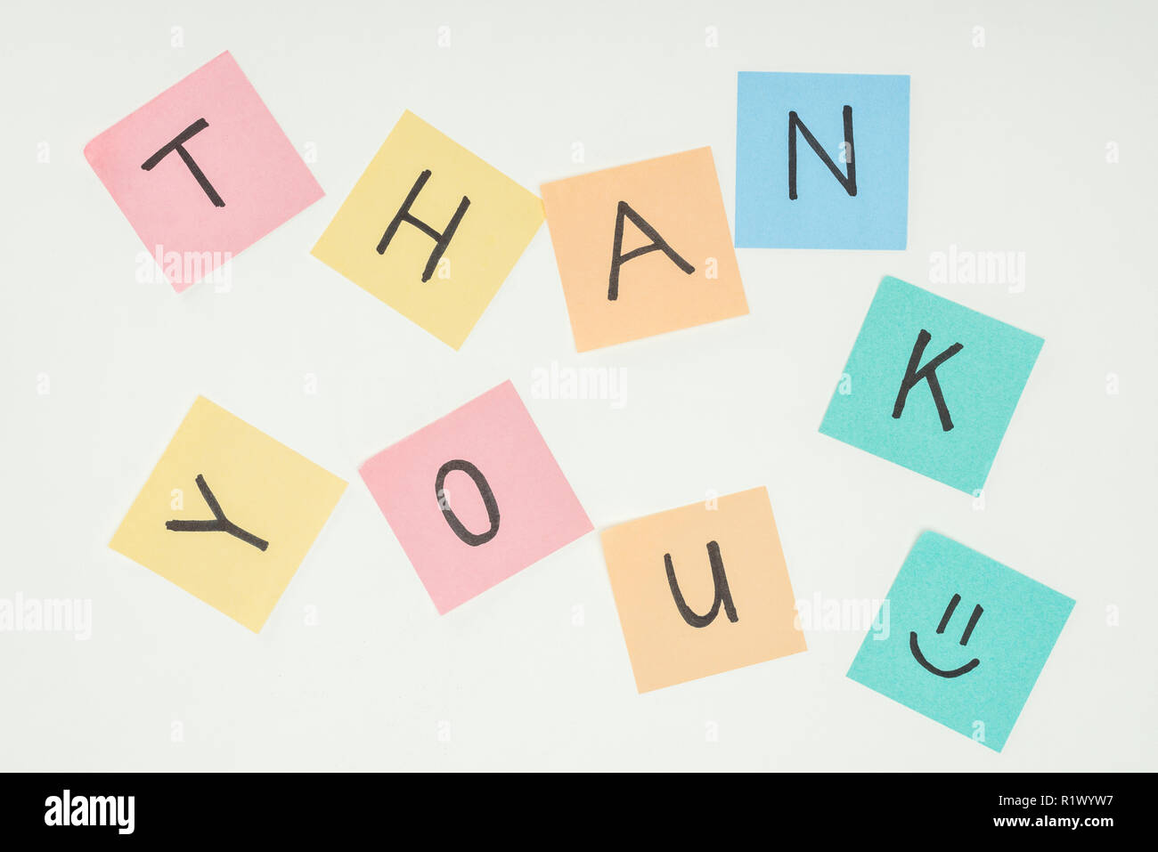 colorful sticky notes spelling thank you isolated on white background ...