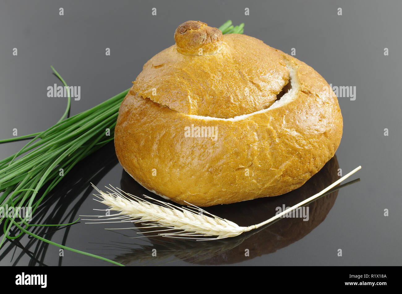 empty bread bowl with a lid on dark background Stock Photo - Alamy