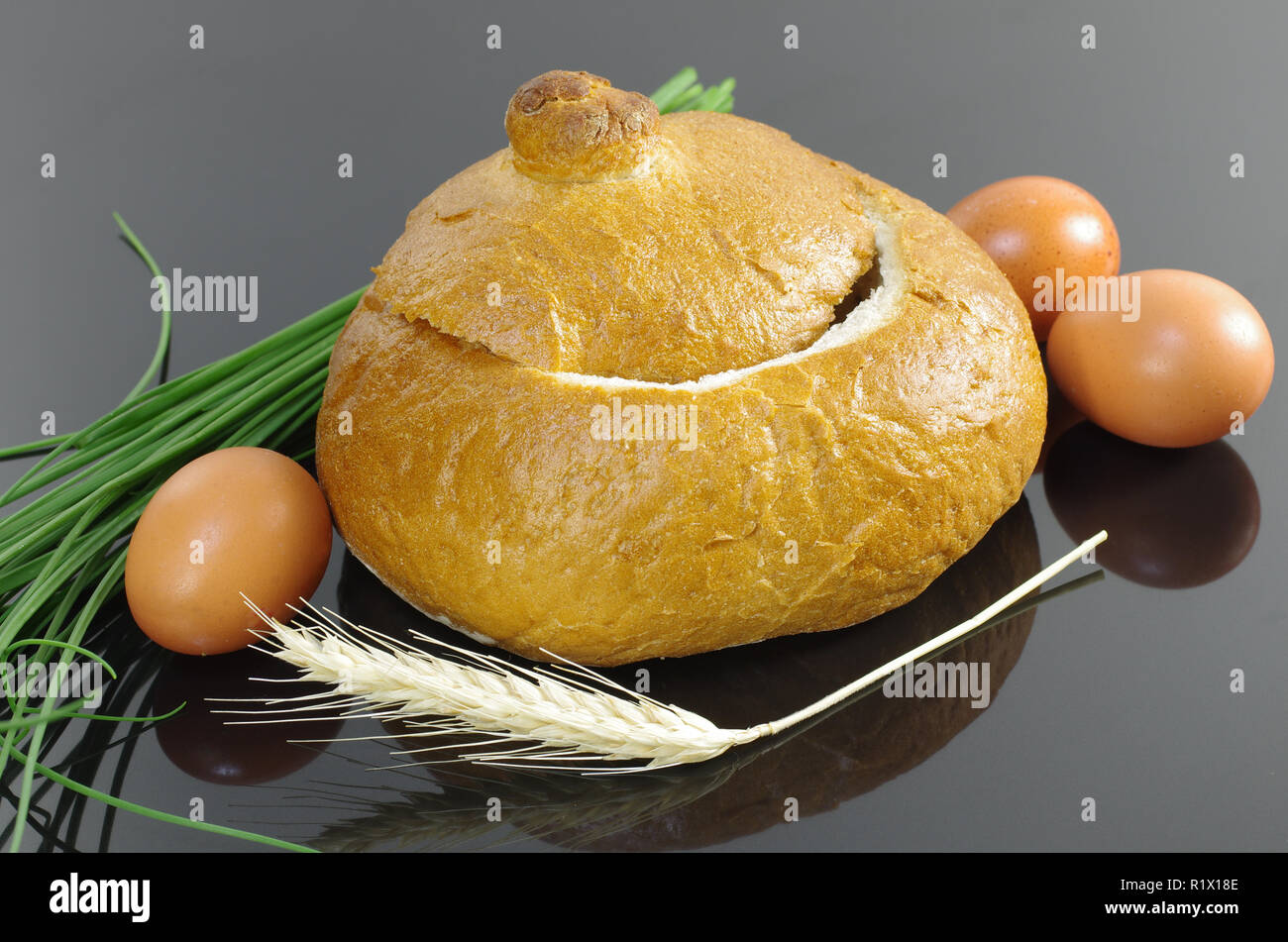 empty bread bowl with a lid on dark background Stock Photo - Alamy