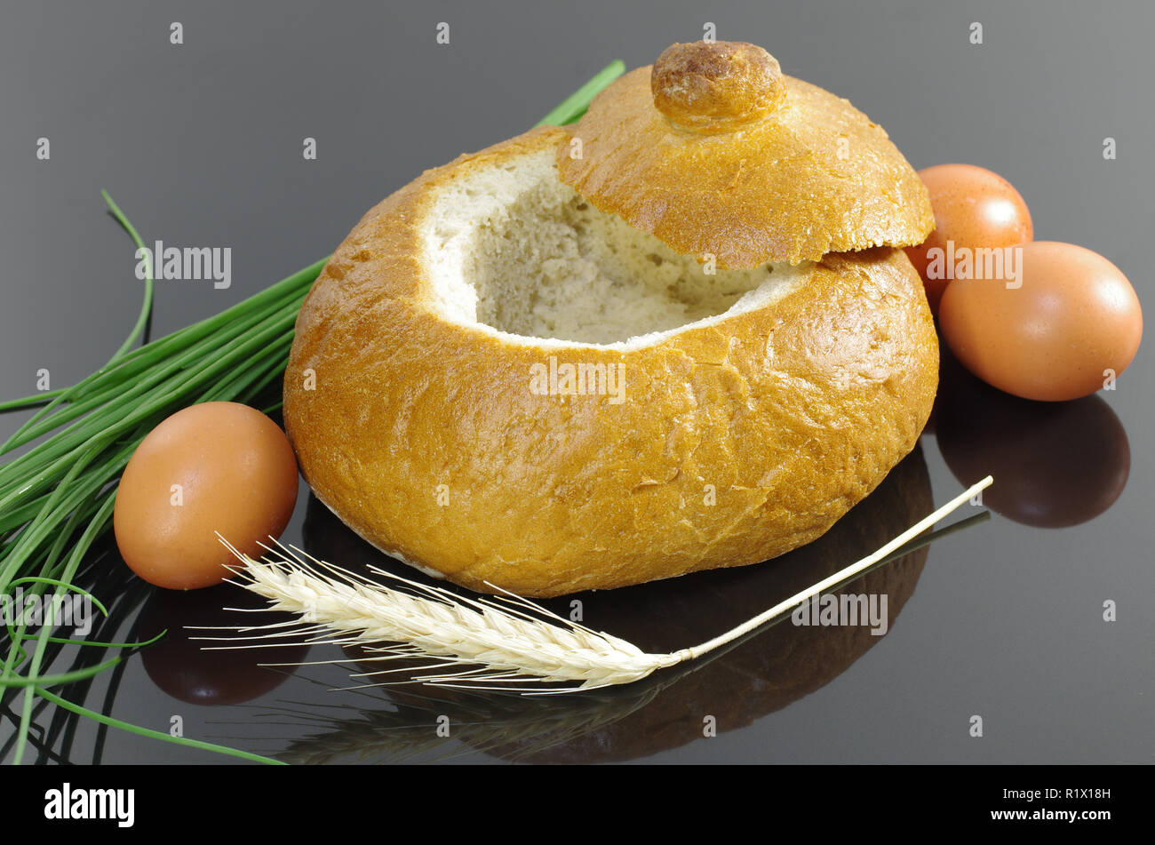 empty bread bowl with a lid on dark background Stock Photo - Alamy