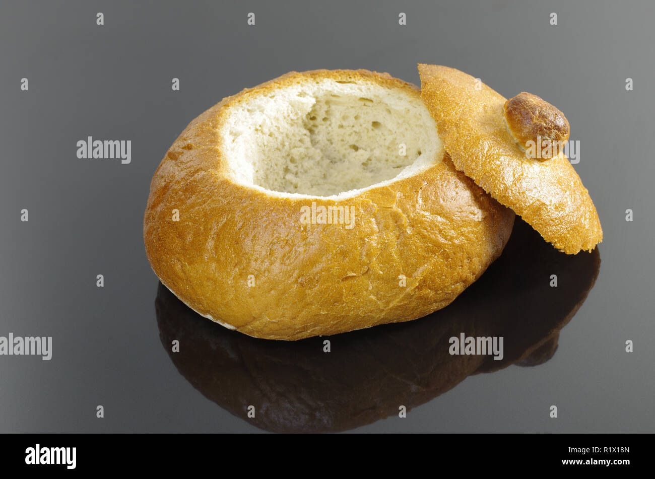empty bread bowl with a lid on dark background Stock Photo - Alamy