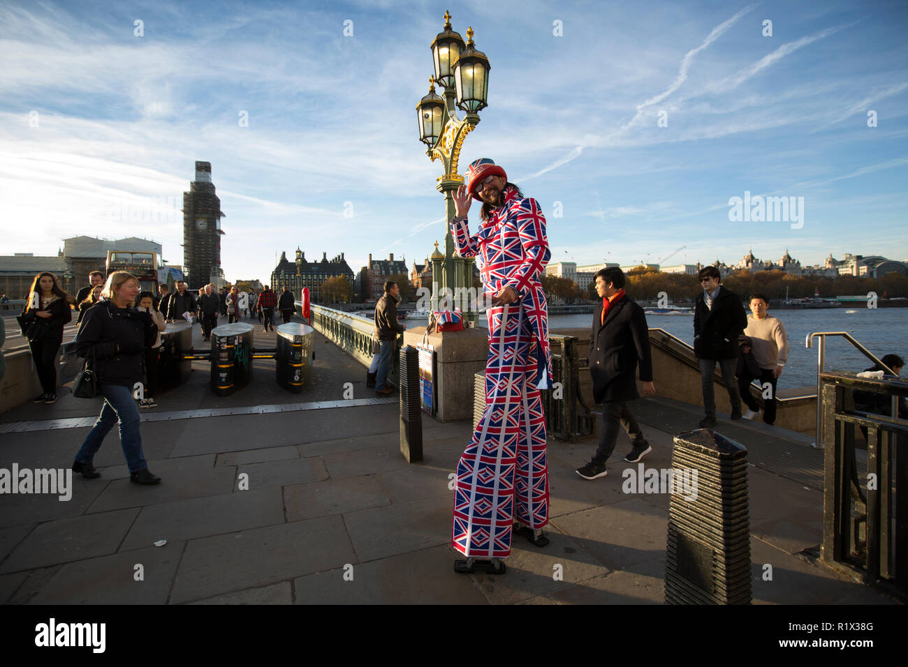 Man wearing Union Jack printed suit stood upon stilts at the southern ...