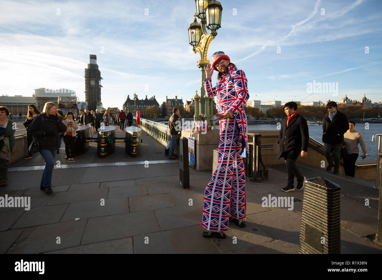 Man wearing Union Jack printed suit stood upon stilts at the southern ...