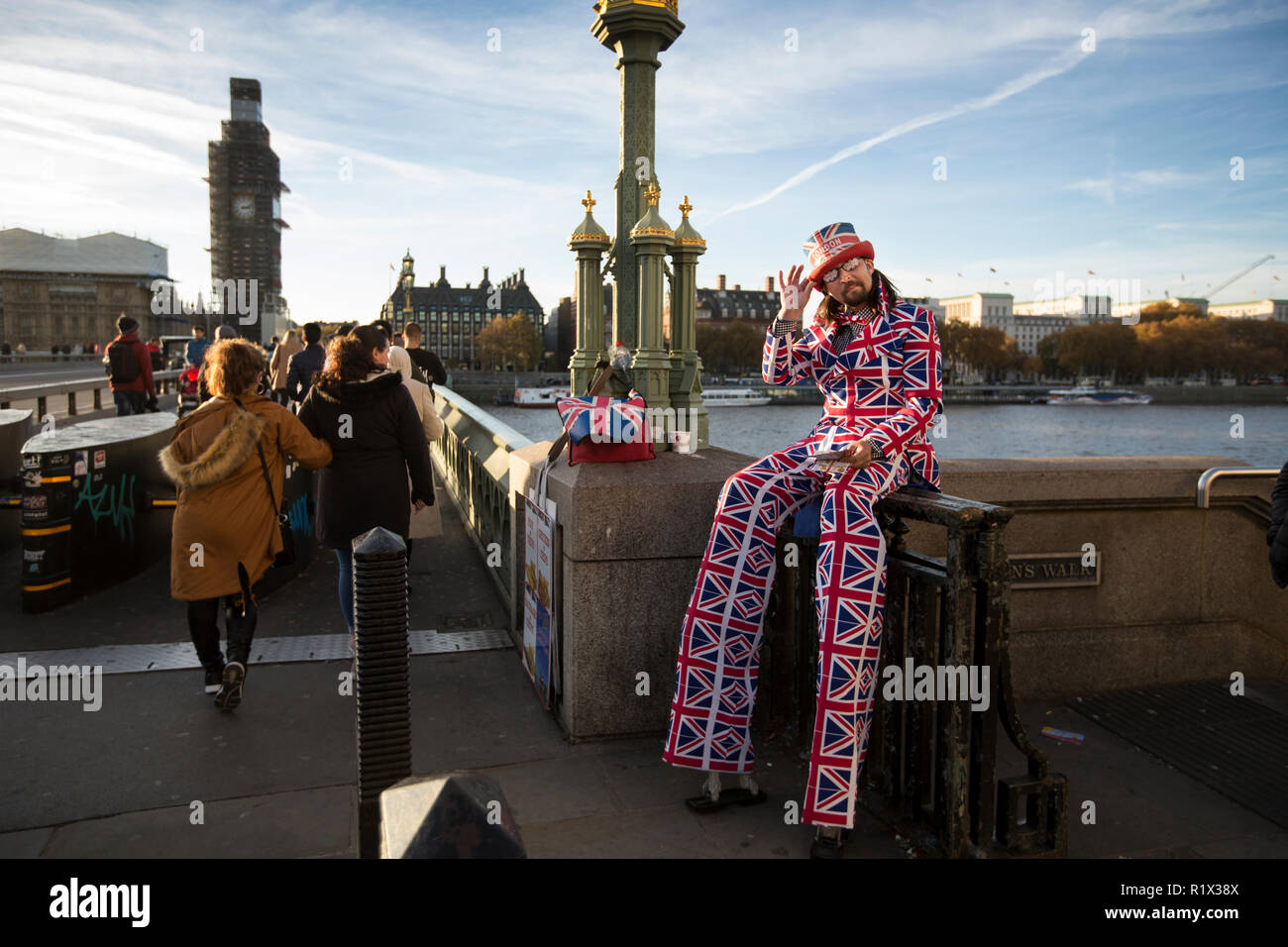 Man wearing Union Jack printed suit stood upon stilts at the southern ...