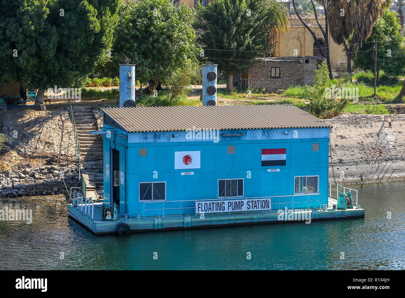 A floating pumping station on the River Nile at Aswan, Egypt, Africa ...