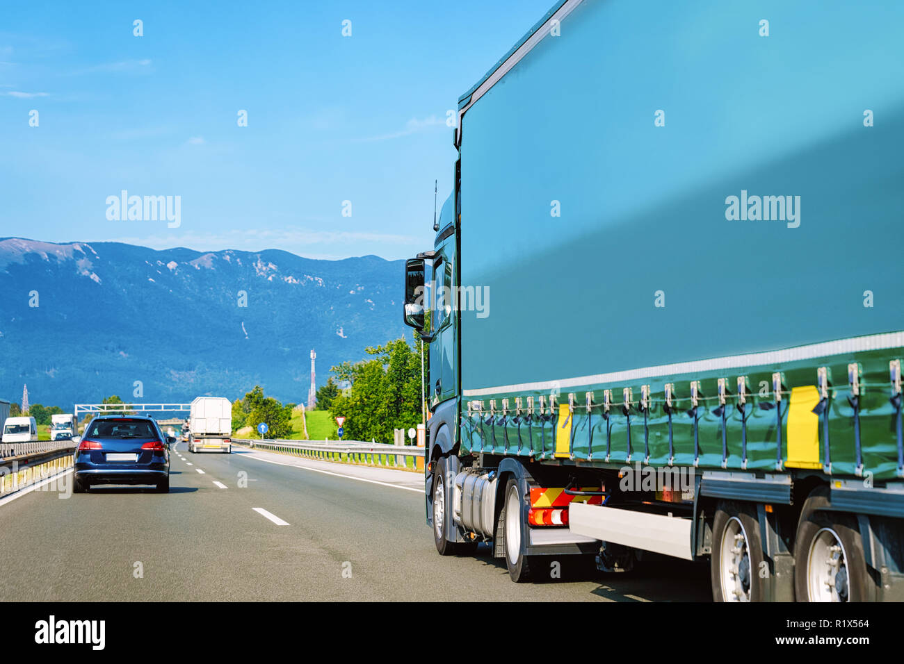 Truck in the asphalt road in Poland. Lorry transport delivering some ...