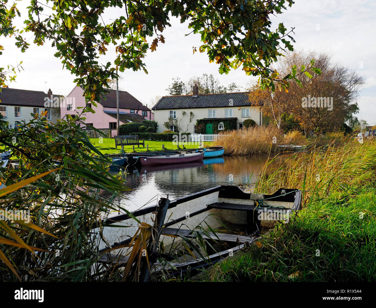 Boats moored in the narrow cut of West Somerton staithe, a remote part ...