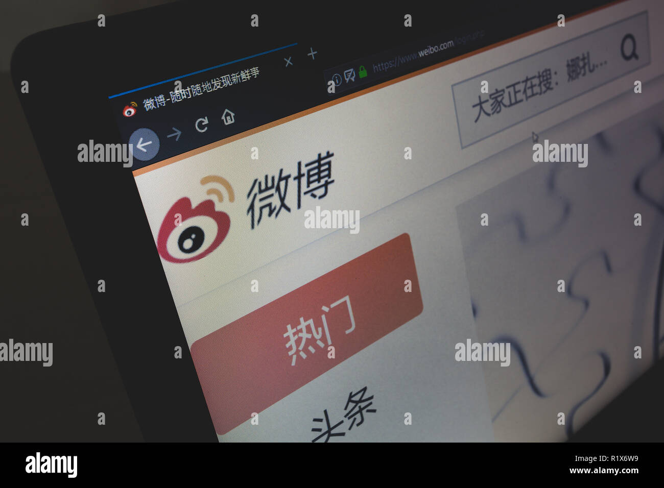Weibo, Chinese social media platform logo on its website is shown on a laptop computer screen ...