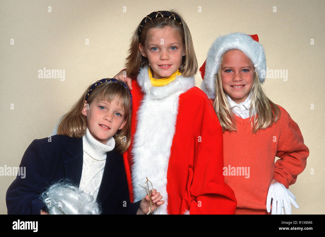 Triplet Girls Pose at Christmas time, 1990's, USA Stock Photo - Alamy