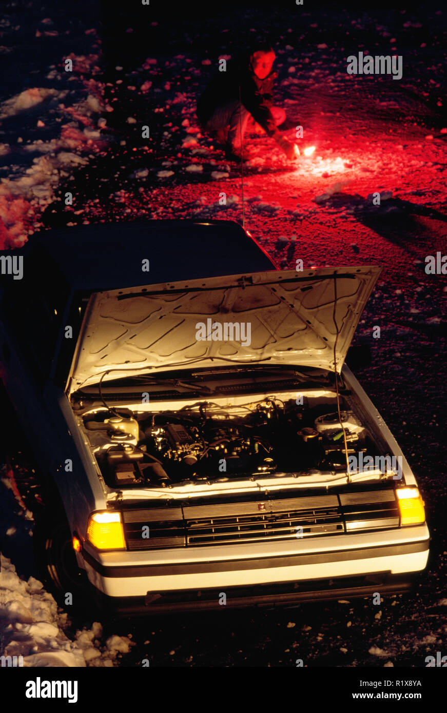 Man Lighting Roadside Flare with Broken-down Car on a Country Road on a ...