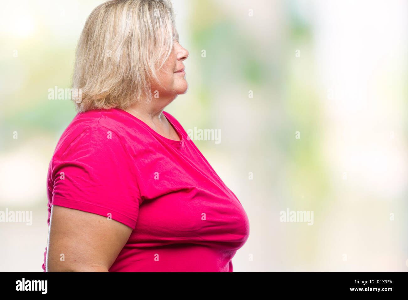 Senior plus size caucasian woman over isolated background looking to ...