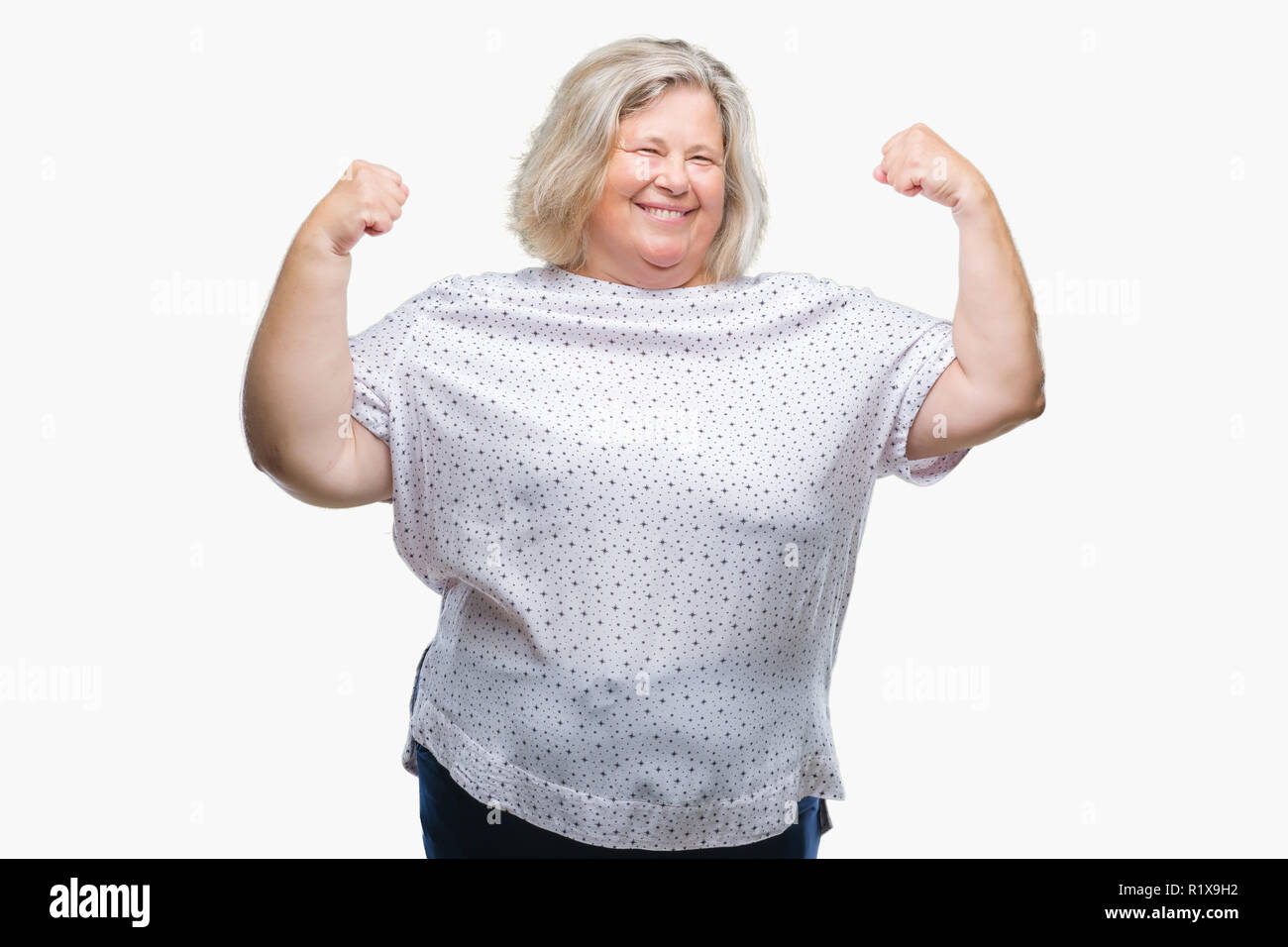 Senior plus size caucasian woman over isolated background showing arms ...