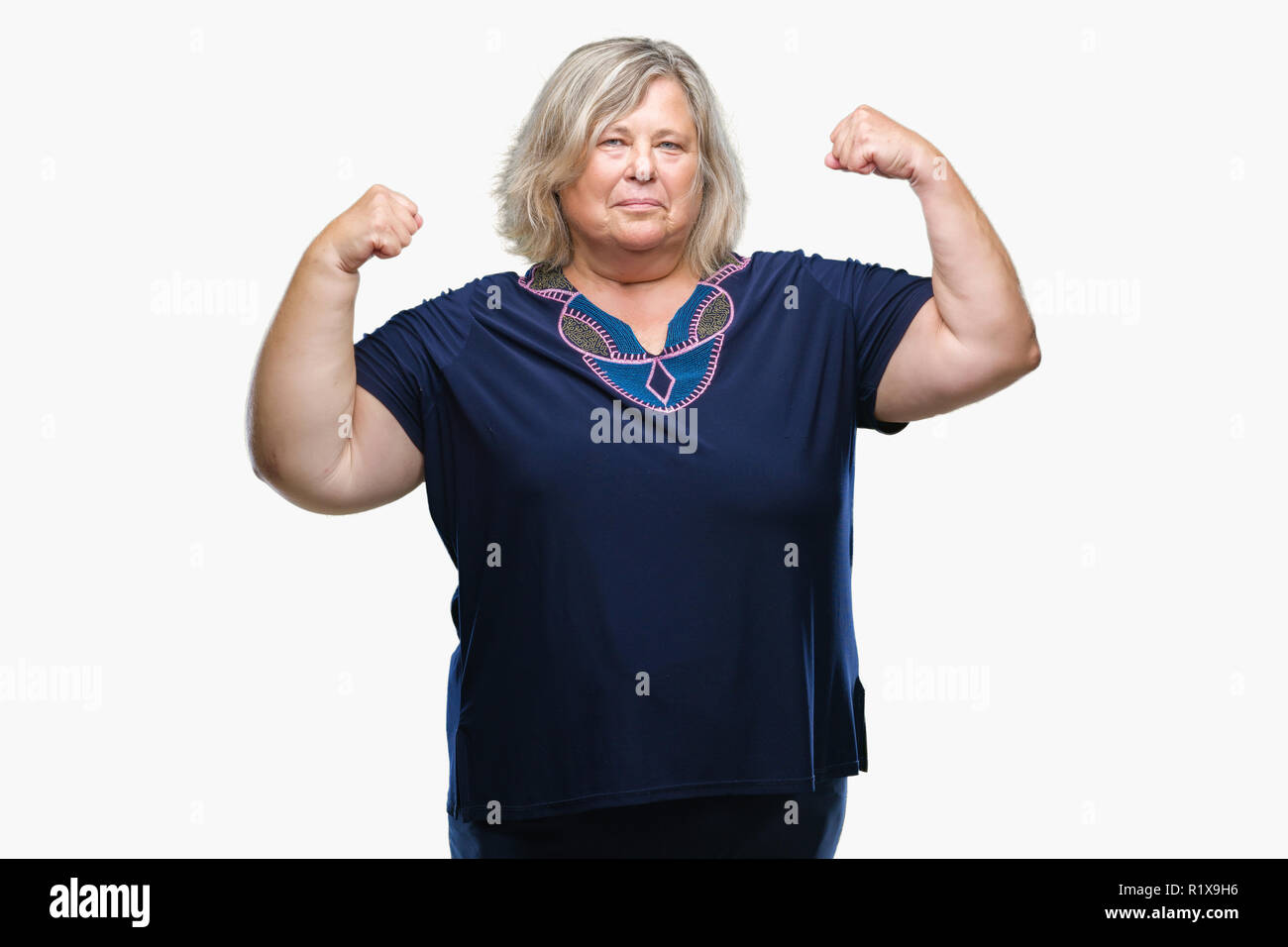 Senior plus size caucasian woman over isolated background showing arms ...