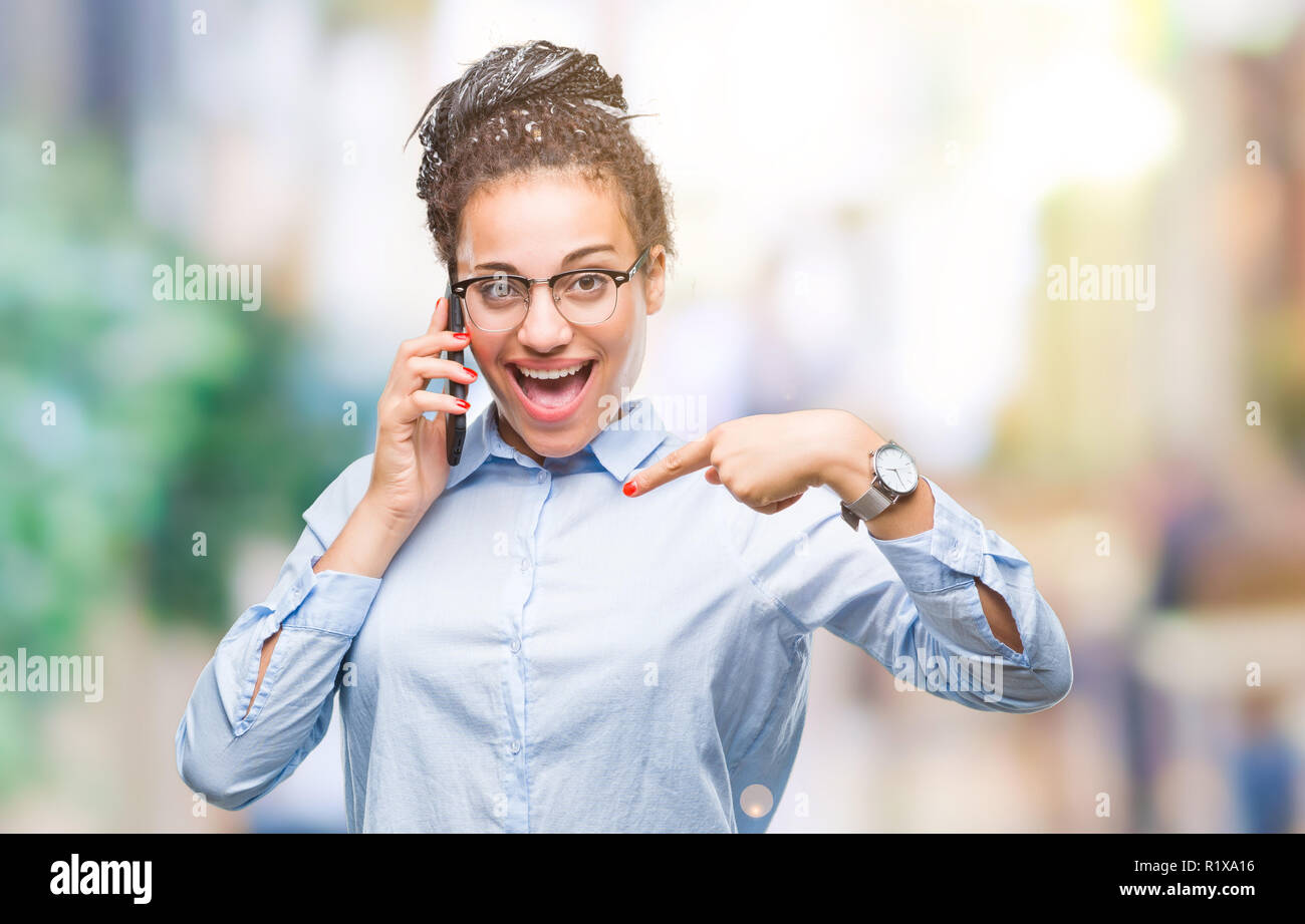 Young braided hair african american business girl showing calling using ...