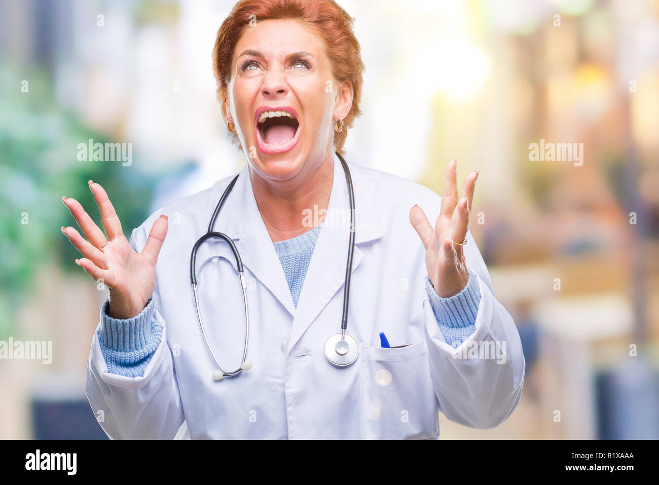 Senior caucasian doctor woman wearing medical uniform over isolated ...