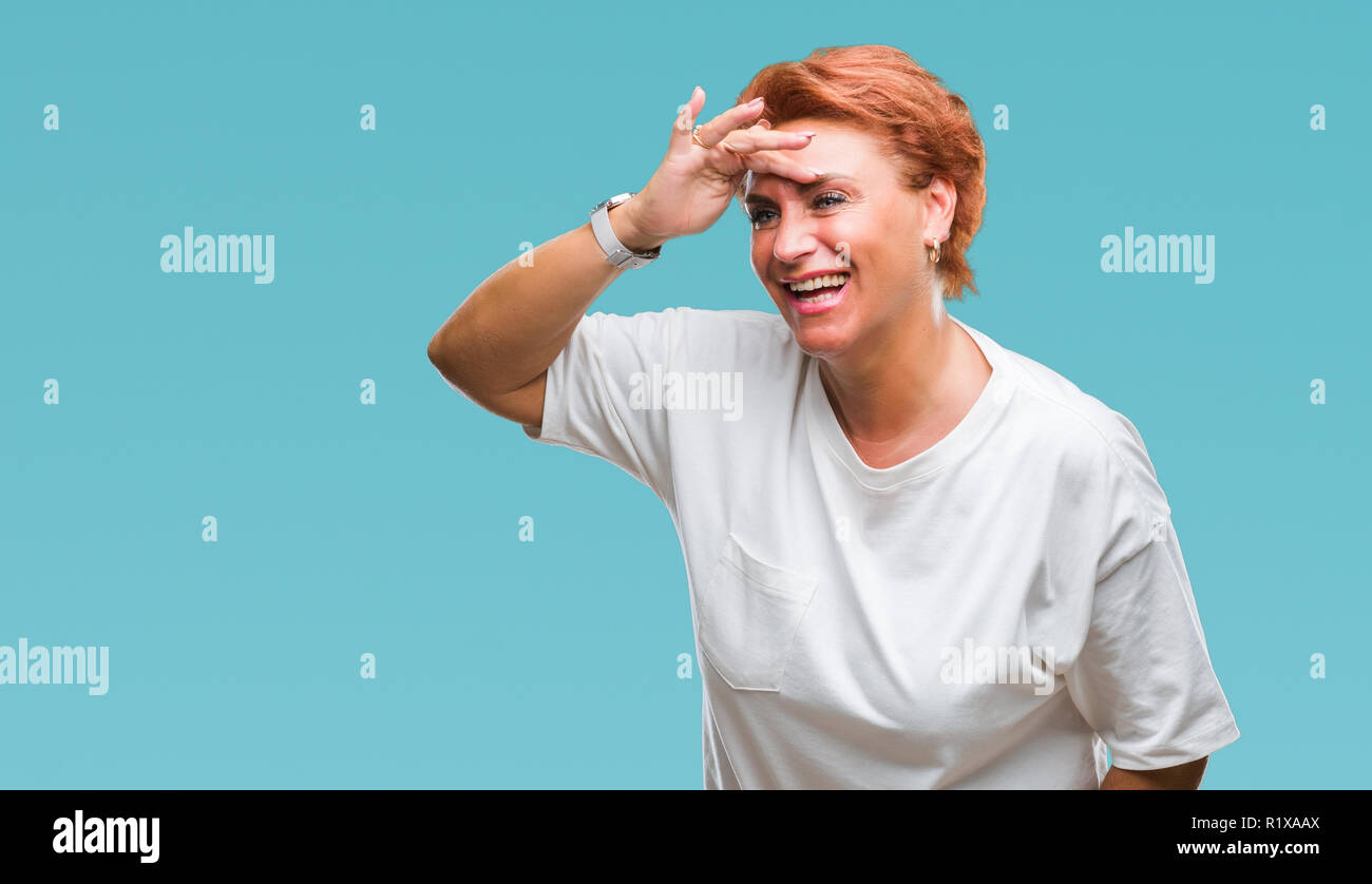 Atrractive senior caucasian redhead woman over isolated background very ...