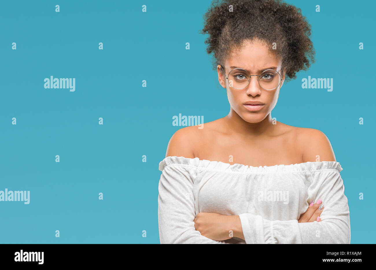Young afro american woman wearing glasses over isolated background ...