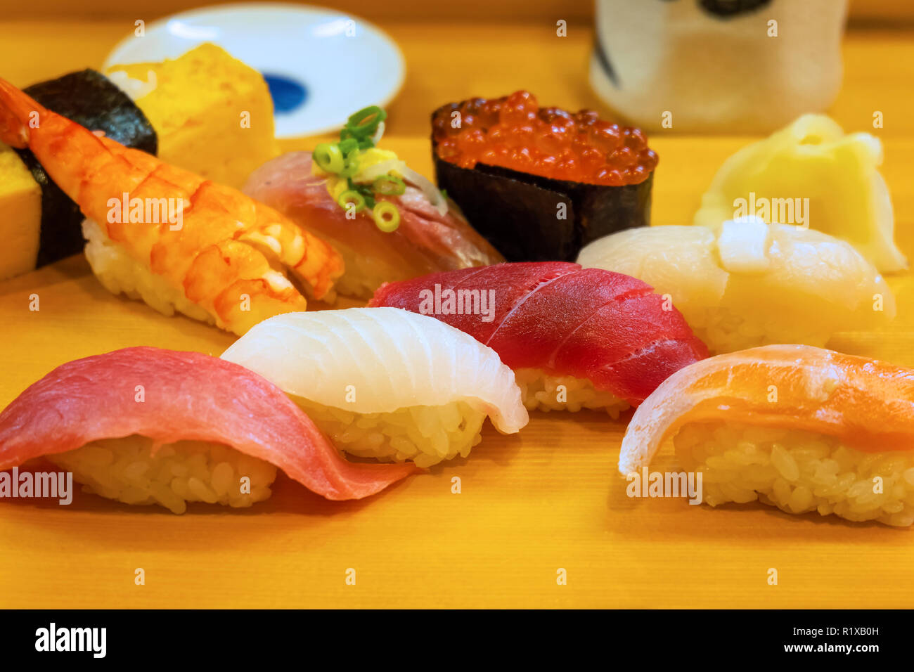 A set of japanese traditional sushi set beautifully decorated on a wood ...