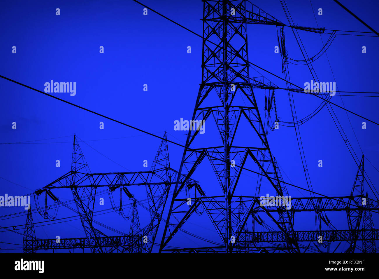 an image of a metal tower of Power Lines Stock Photo - Alamy