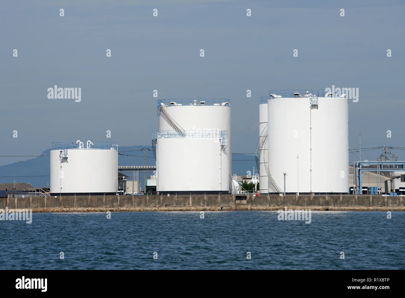 Industrial fuel storage tanks at oil refinery Stock Photo - Alamy