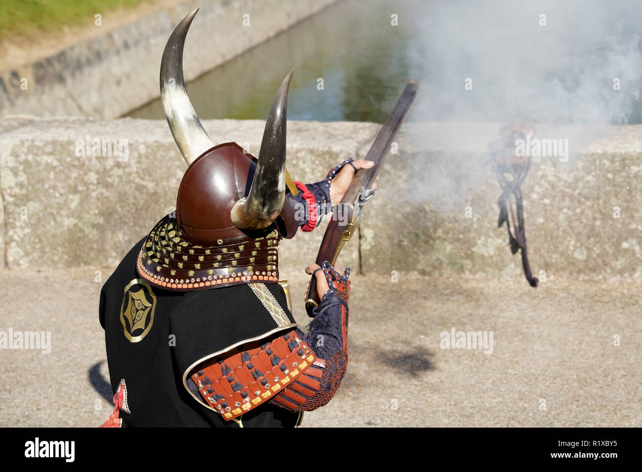Japanese samurai clothing yoroi and kabuto uniform with old rifle Stock ...