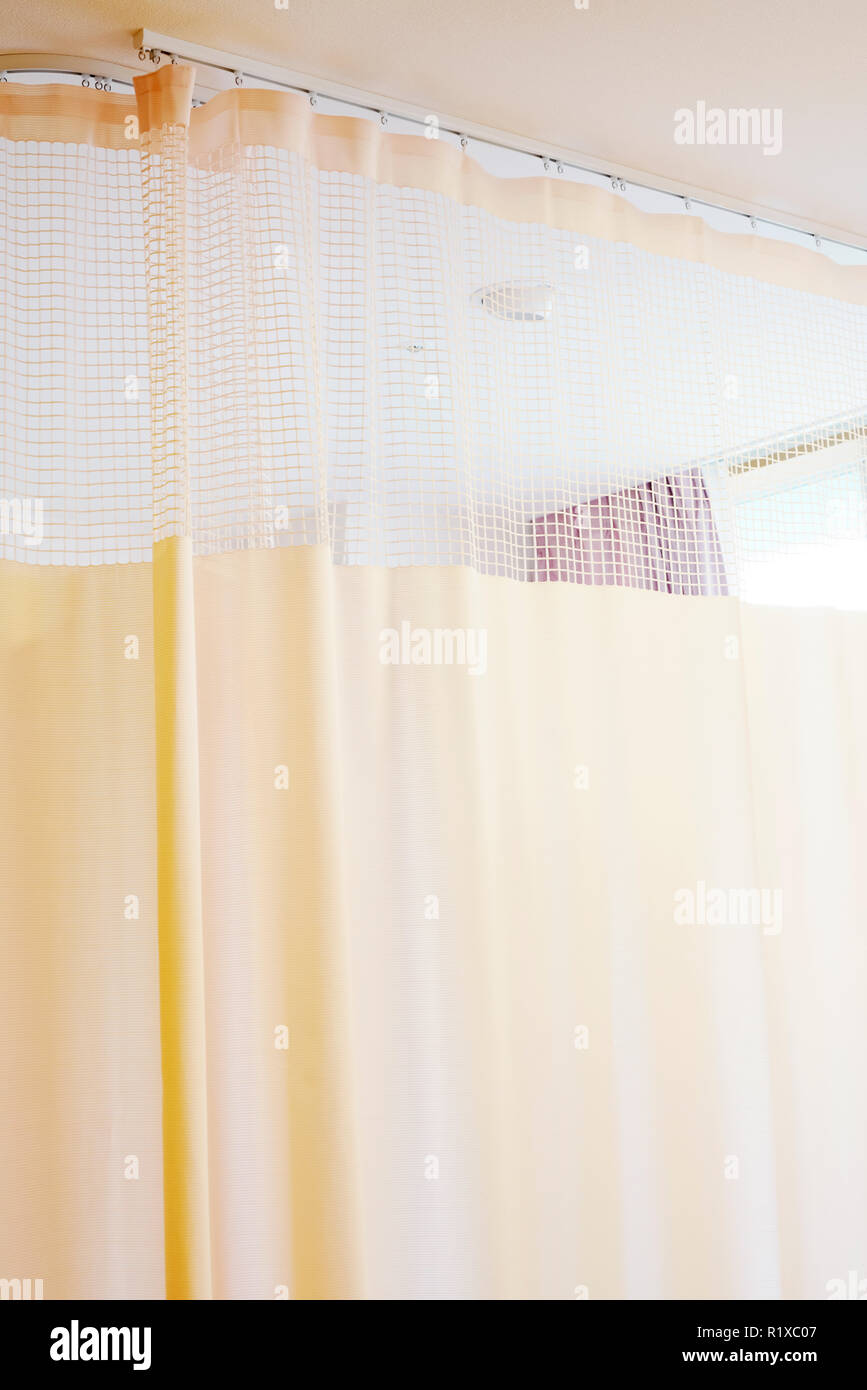 Medical curtain hanging from a railing in a hospital room, Privacy ...