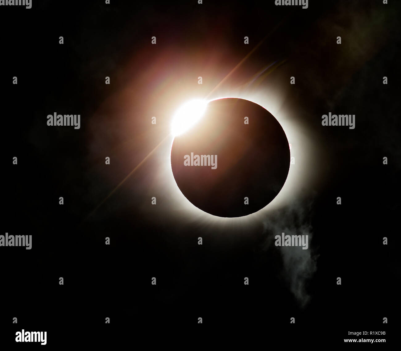 Eclipse 2017 Diamond Ring effect with clouds Stock Photo - Alamy