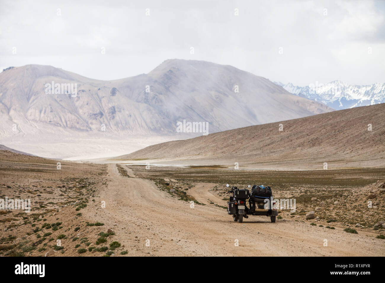 A sidecar motorcycle backed by a mountain range Stock Photo - Alamy