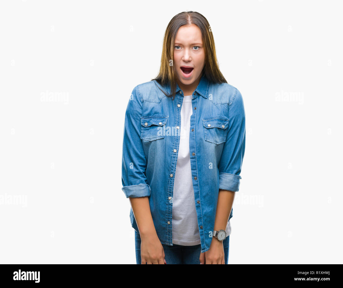 Young caucasian beautiful woman over isolated background afraid and ...