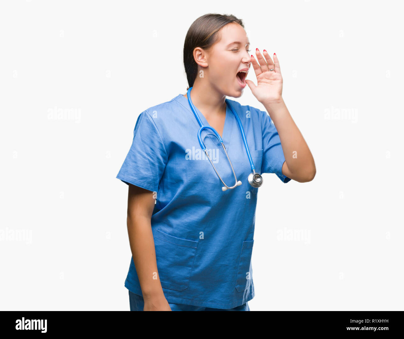 Young caucasian doctor woman wearing medical uniform over isolated ...