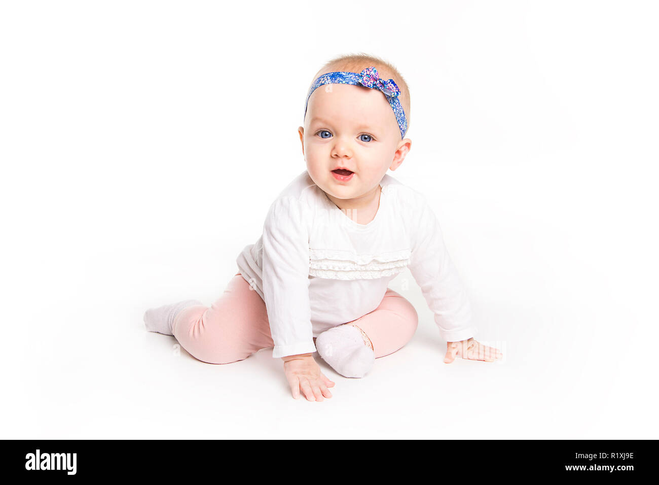 A six month old baby, in front of a white background Stock Photo - Alamy